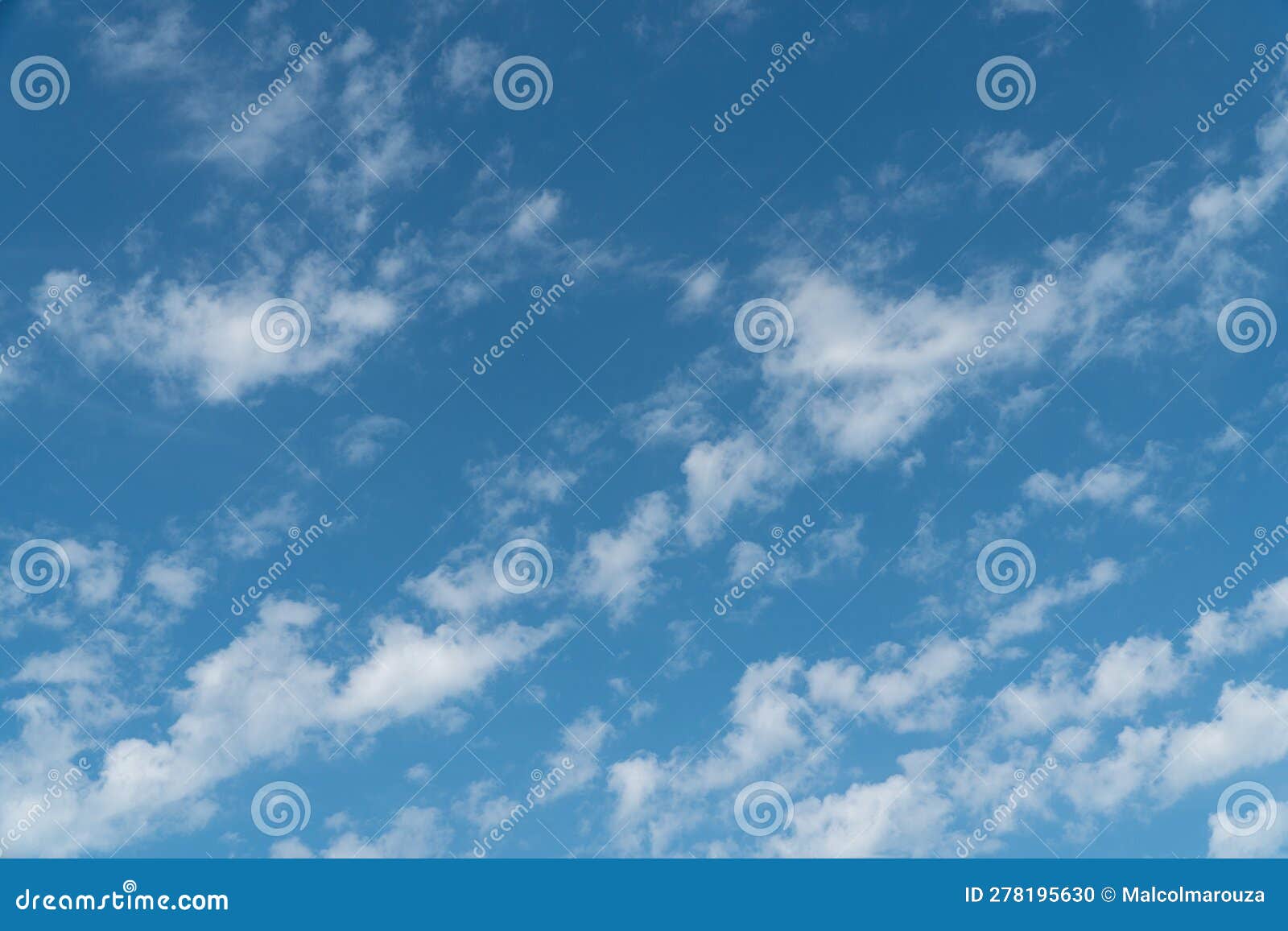 Blue Sky with a Few Scattered White Clouds Stock Photo - Image of blue ...