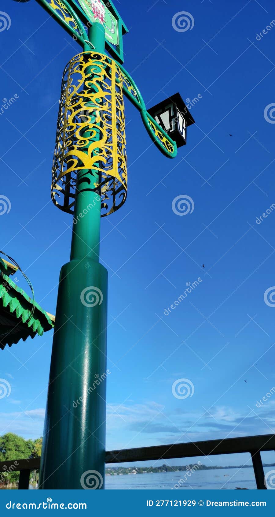 Blue Sky with Green and Yellow Lampposts Stock Image - Image of yellow ...