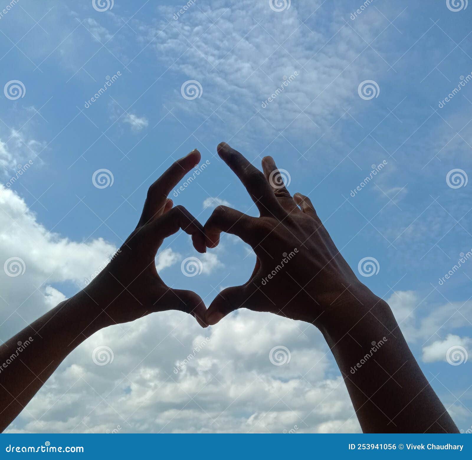 Blue sky with hands stock photo. Image of person, hands - 253941056