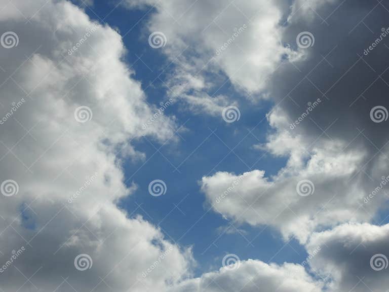 Blue Sky Opening through the Clouds Stock Image - Image of white ...