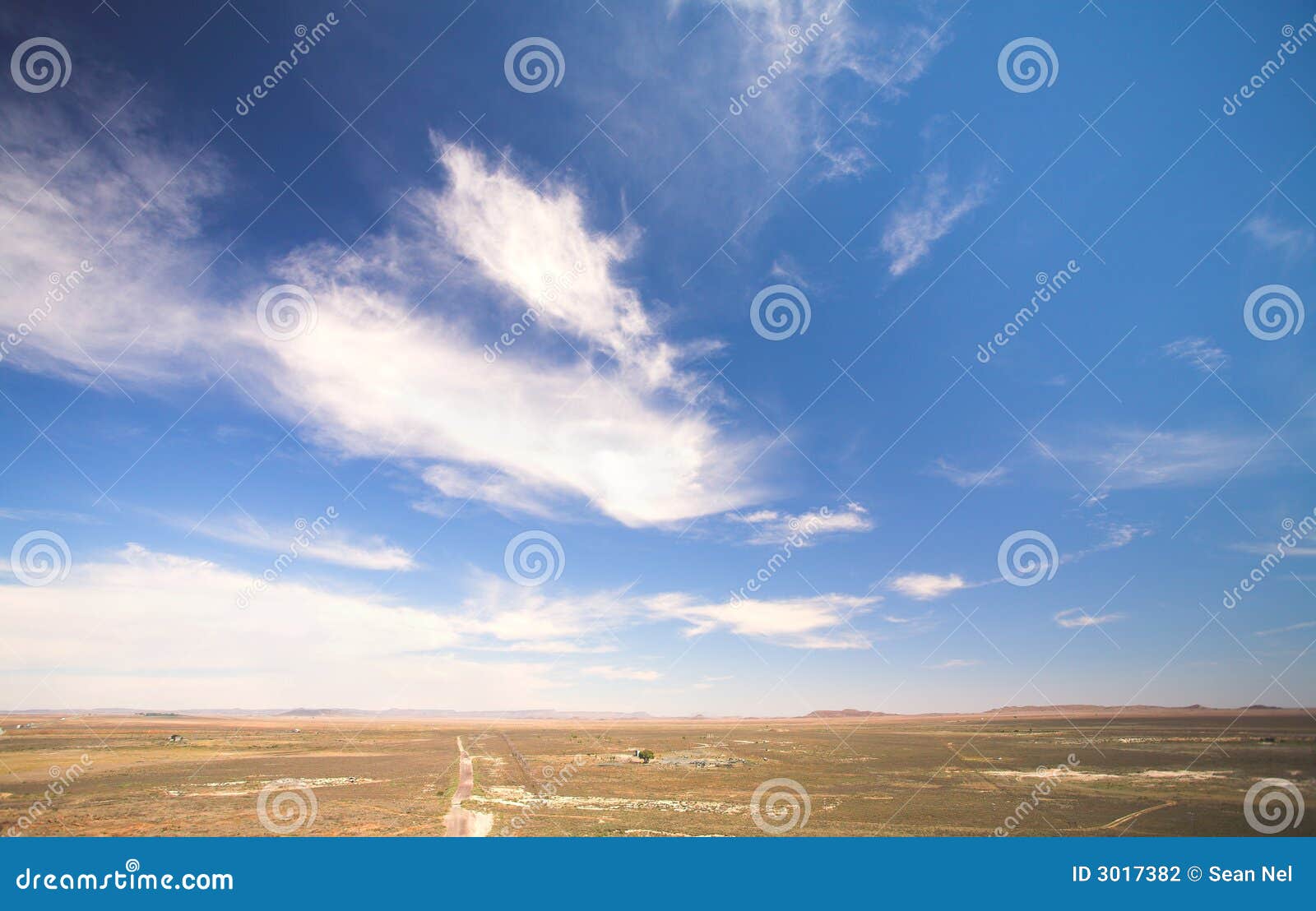 Blue sky over a dry desert stock photo. Image of landscape - 3017382