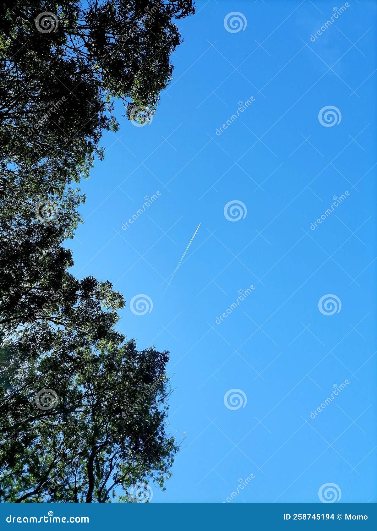 The Blue Sky and the Plane in the Distance Stock Photo - Image of line ...