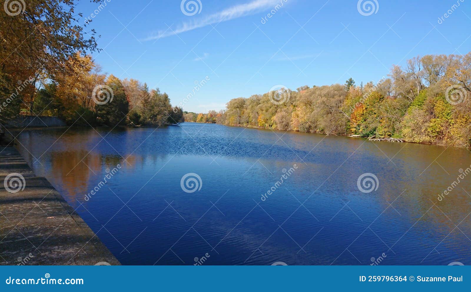 Blue Sky Blue River Waters with Autumn Colors Stock Photo - Image of ...