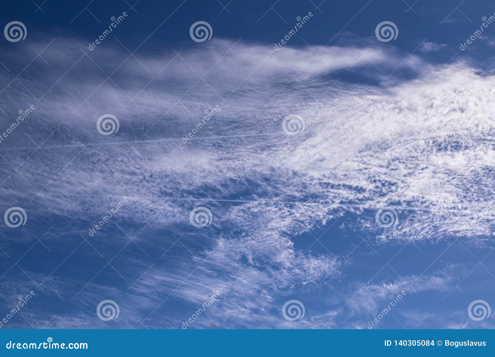A Blue, Slightly Cloudy Sky. Stock Photo - Image of trail, planes ...