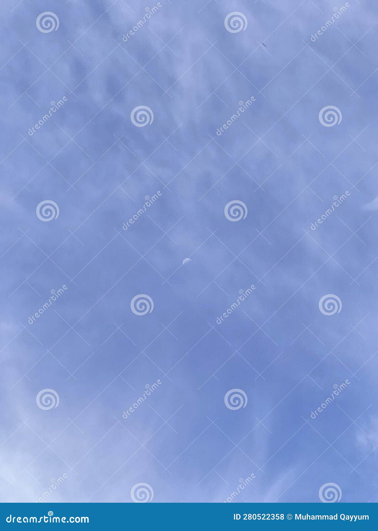 Blue Sky with a Small Moon at the Center of the Image Stock Photo ...