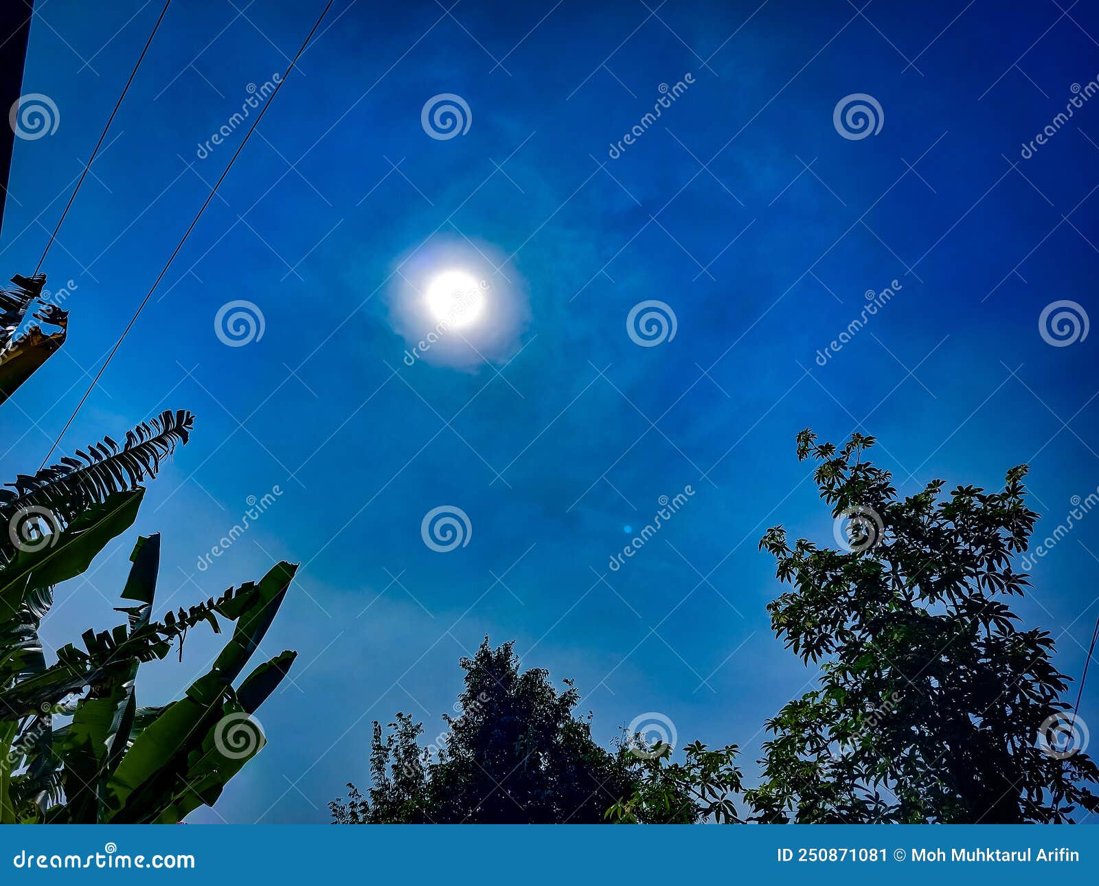 Blue Sky with Sun at Noon with Low Lighting Stock Image - Image of ...
