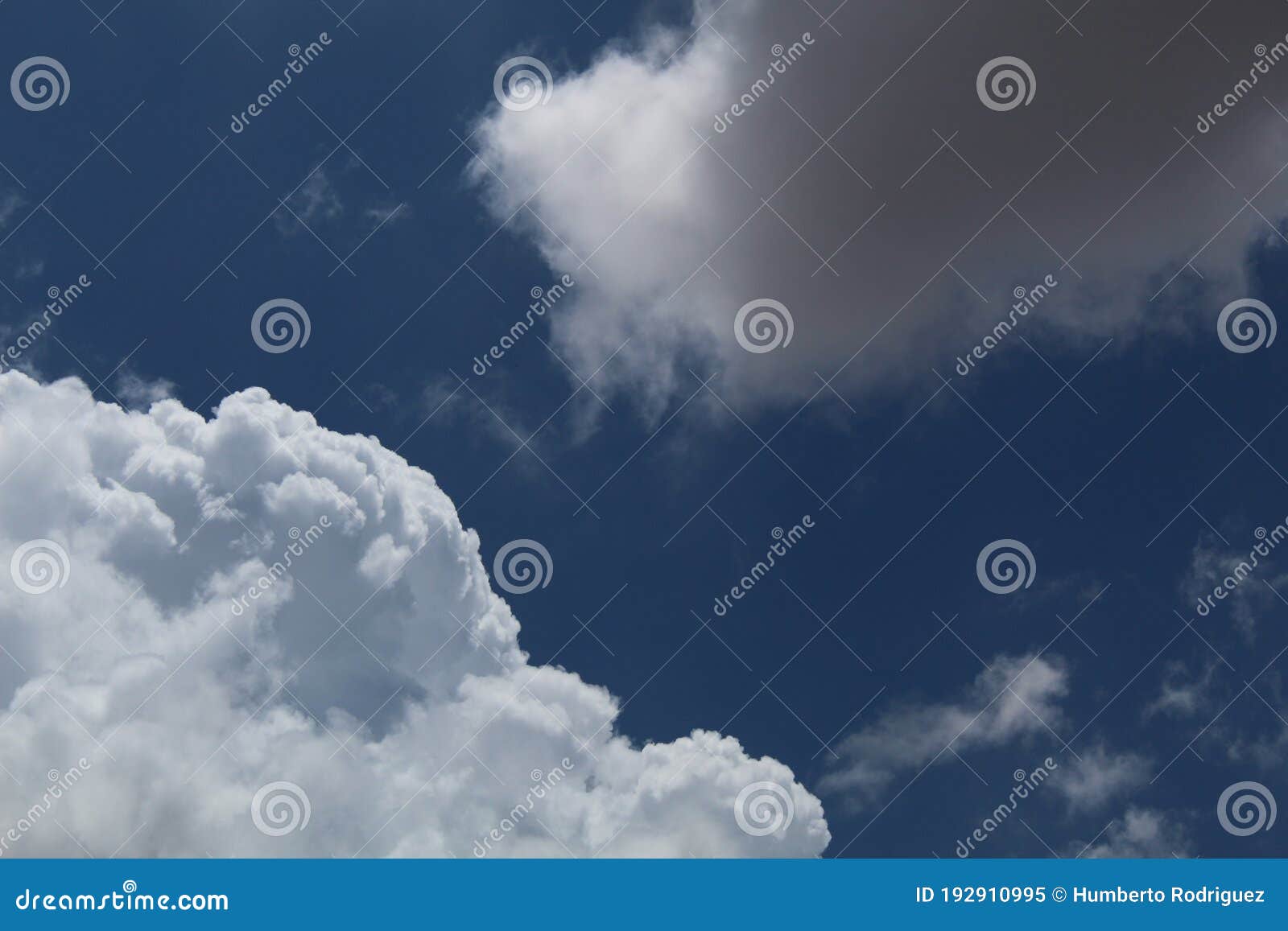 Blue Sky, Two Cluds and One of Rain Stock Image - Image of clouds ...