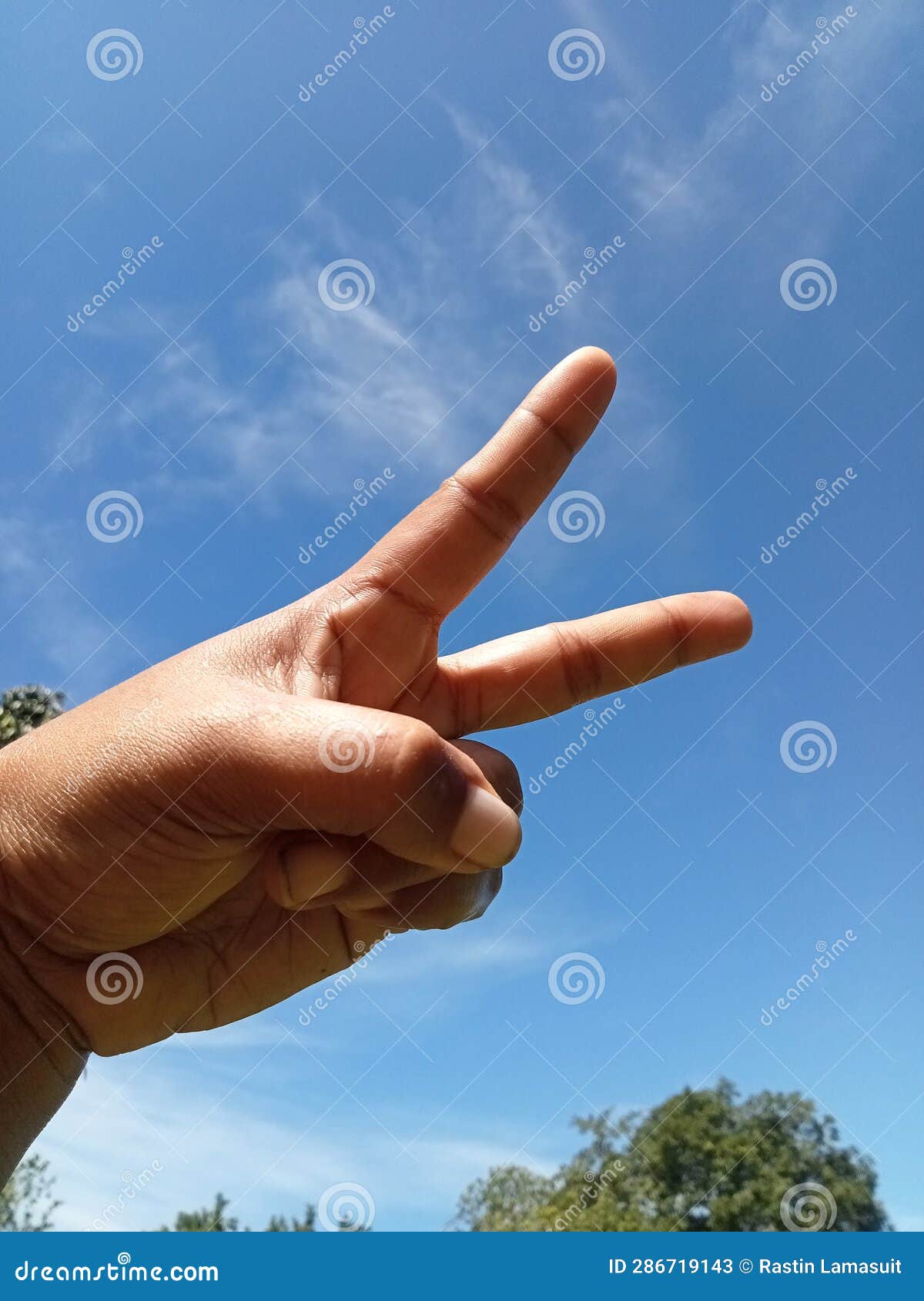 Blue Sky View with Two Finger Greeting Symbol Stock Image - Image of ...