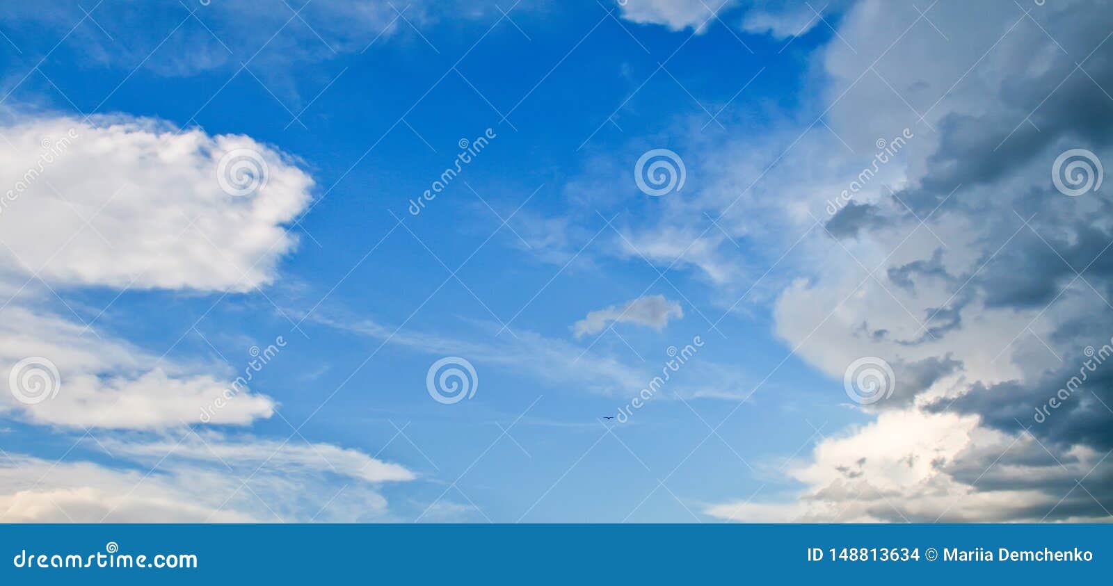 The Blue Sky with White Clouds on One Side, with Dark Clouds on the ...