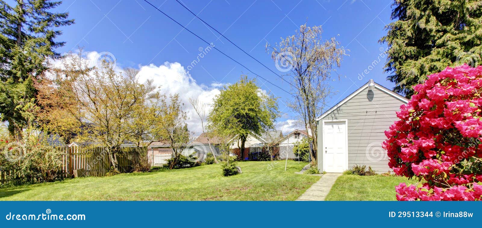 Blue Small Shed with Spring Landscape from Backyard. Stock Photo ...