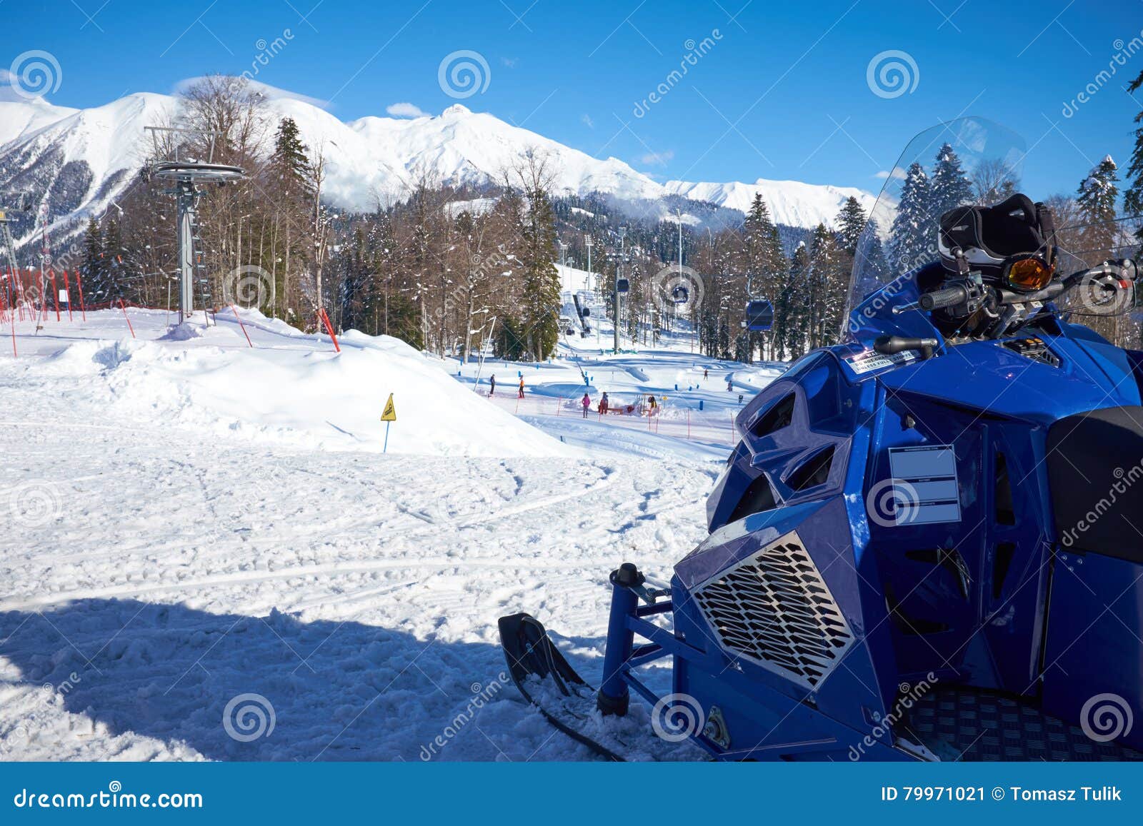 Blue Snowmobile on the Background of Snowy Mountains Stock Image ...