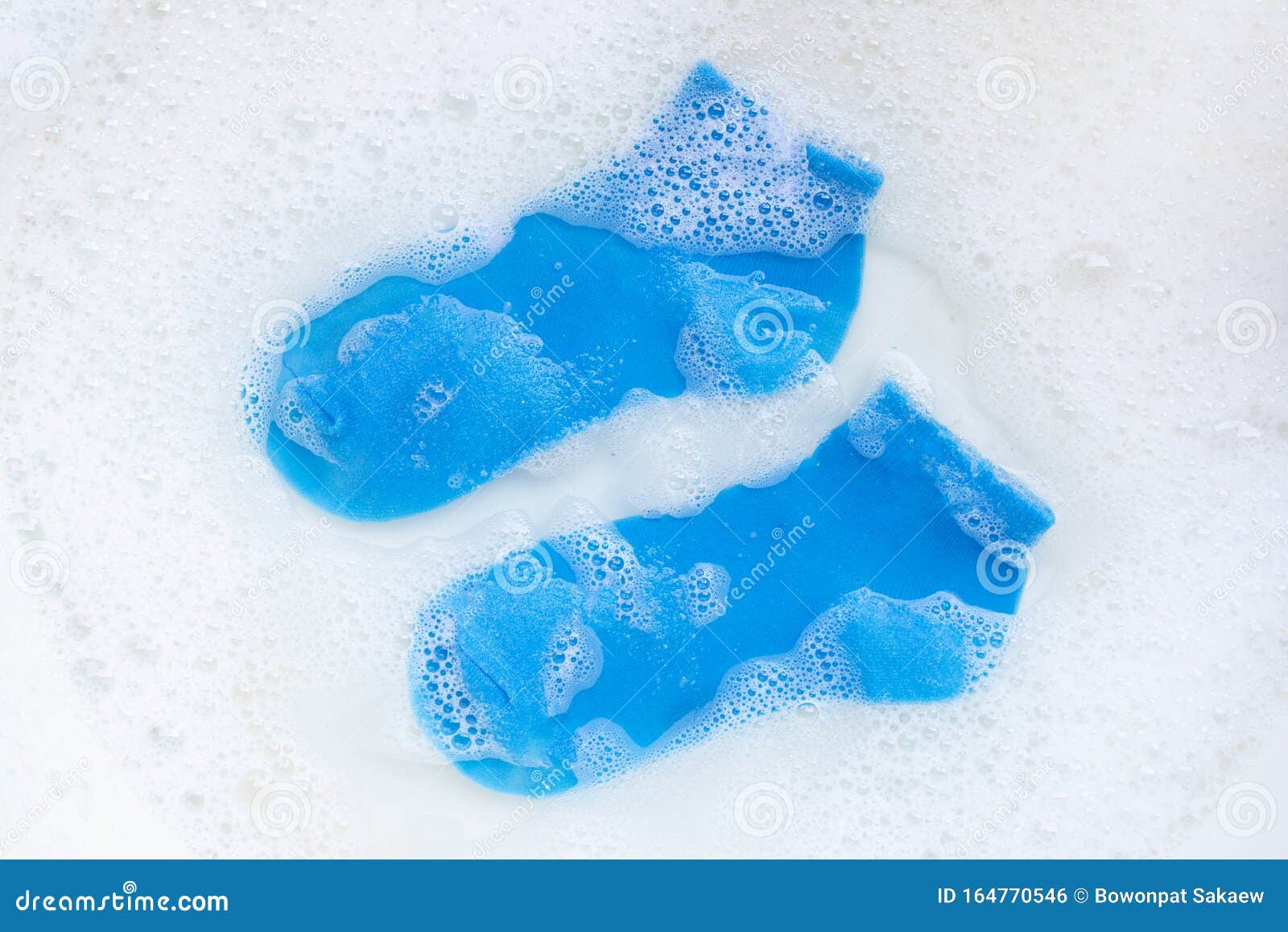Blue Socks Soaking in Powder Detergent Water Dissolution. Laundry ...