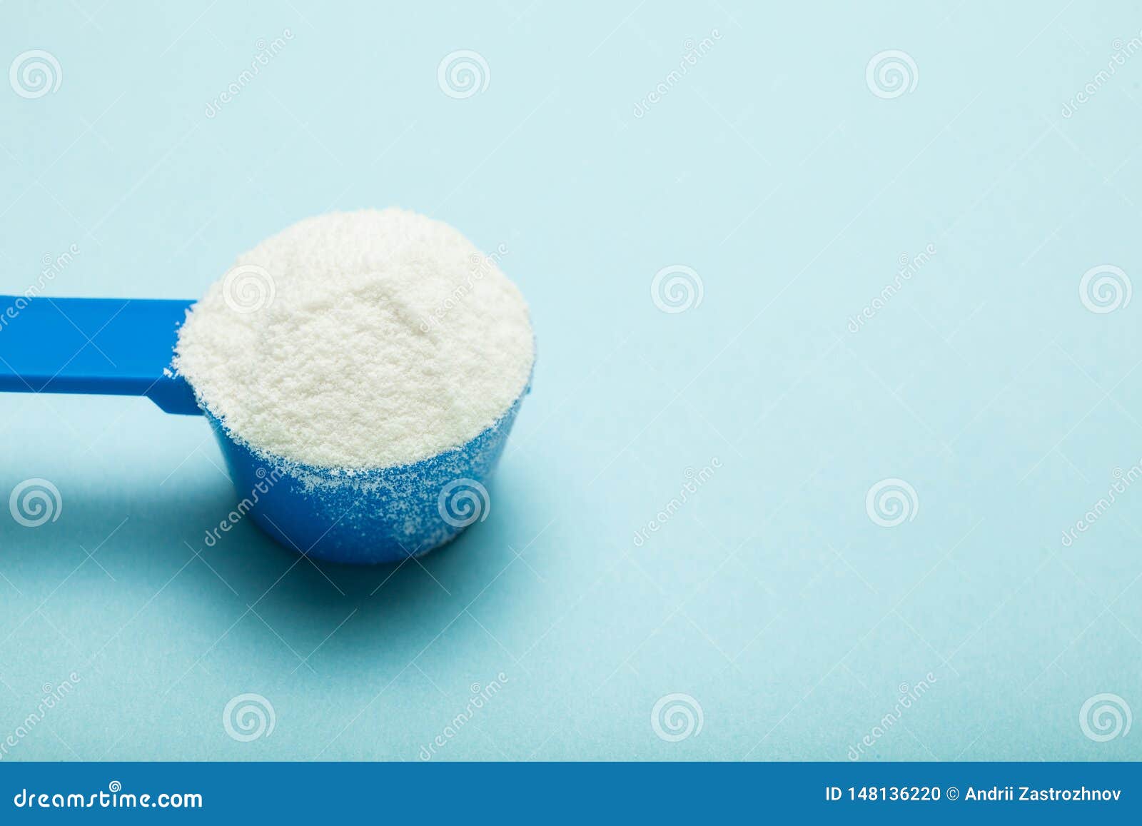 A Blue Spoonful of Milk Powder, Empty Space for Text Stock Photo ...