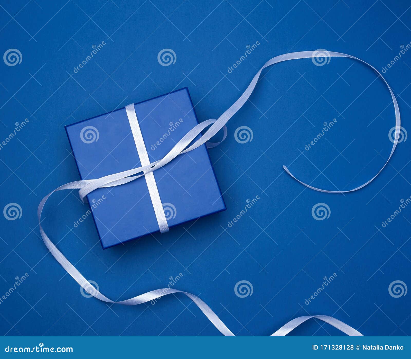 Blue Square Box with a Gift with a Bow on a Blue Classic Background ...