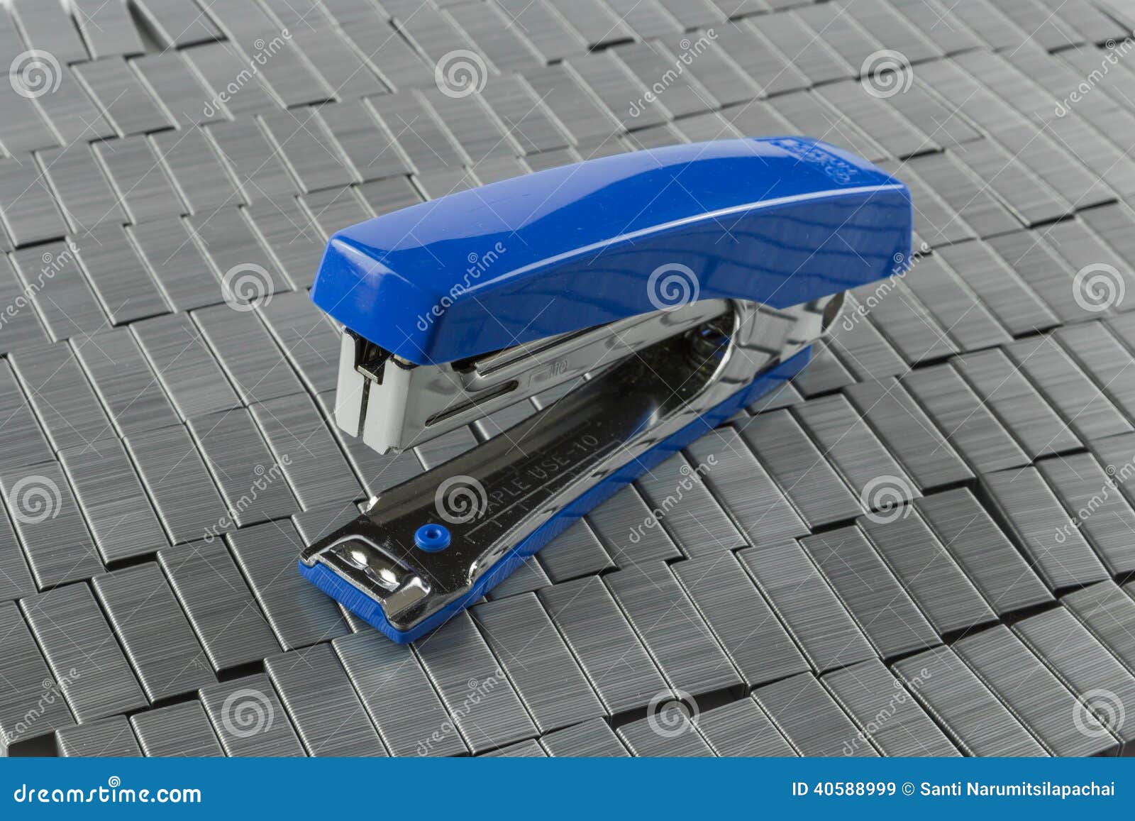 Blue Stapler on Heap of Staples Stock Image - Image of silver ...