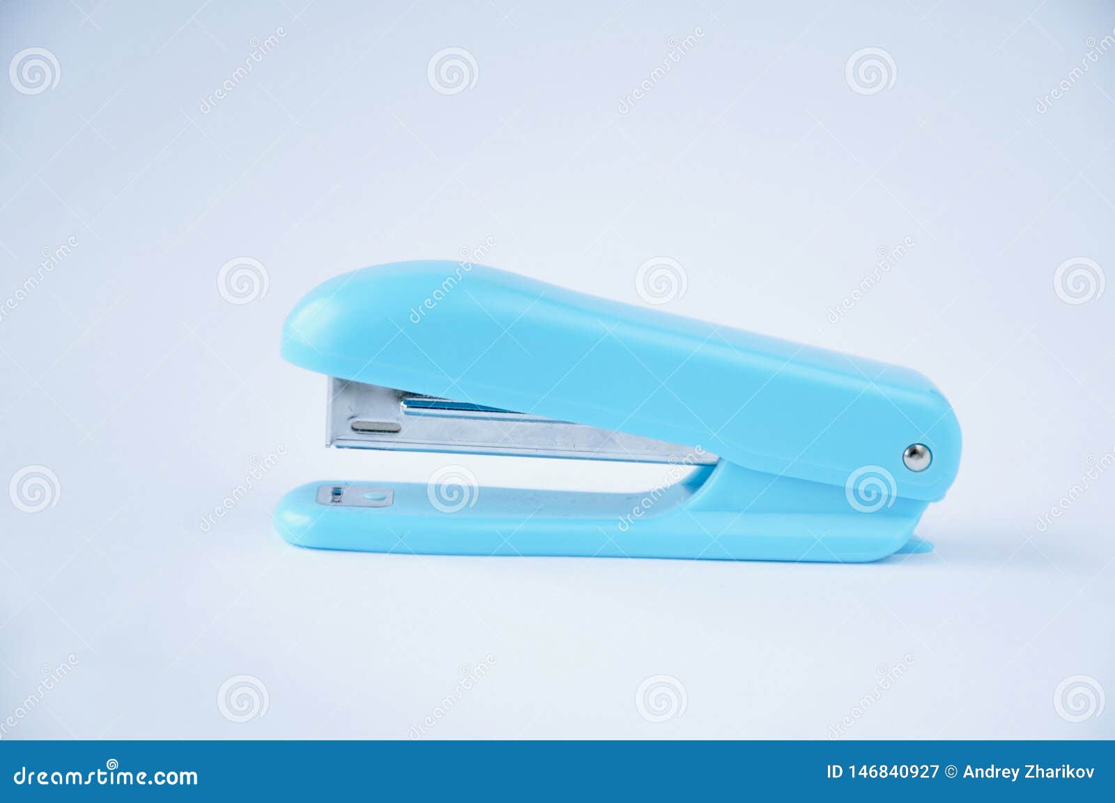 Blue Stapler on White Table Stock Image - Image of plastic, staplers ...