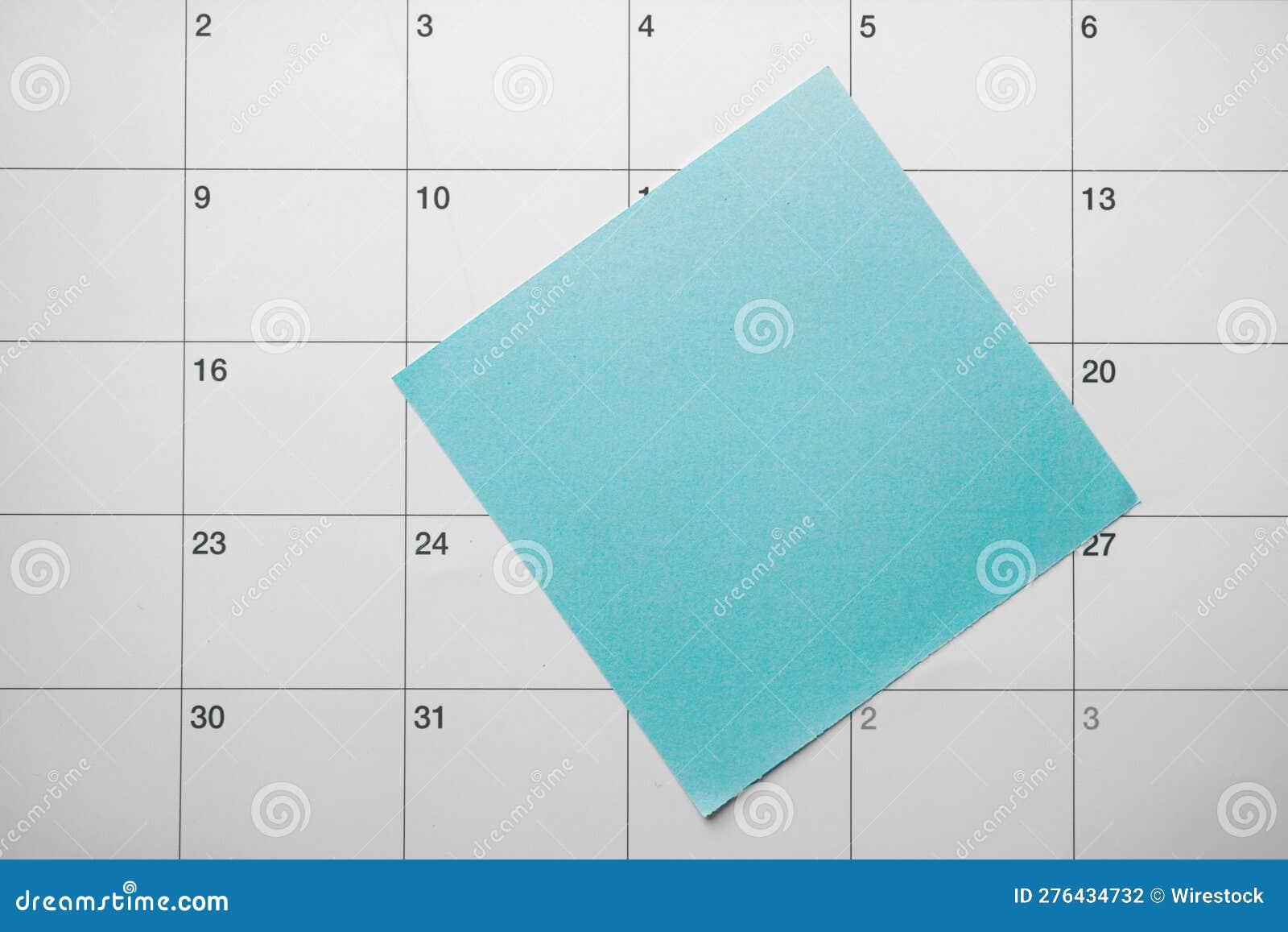 Blue Sticky Note with a Calendar Pad in the Background Stock Photo ...