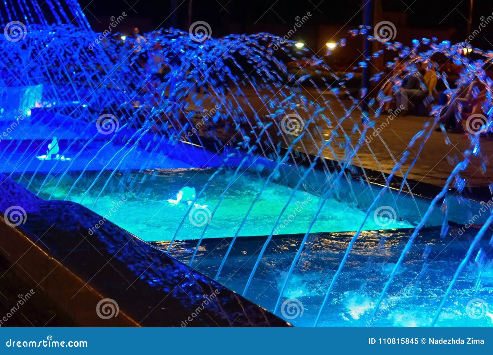 Blue Streams of Glowing Fountain, Illuminated Fountain at Night Stock ...