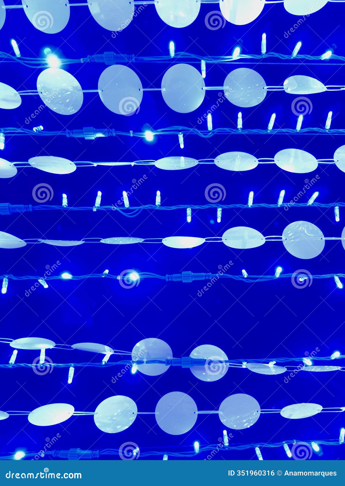 Blue String Lights and Circular Hanging Decorations Form a Striking ...