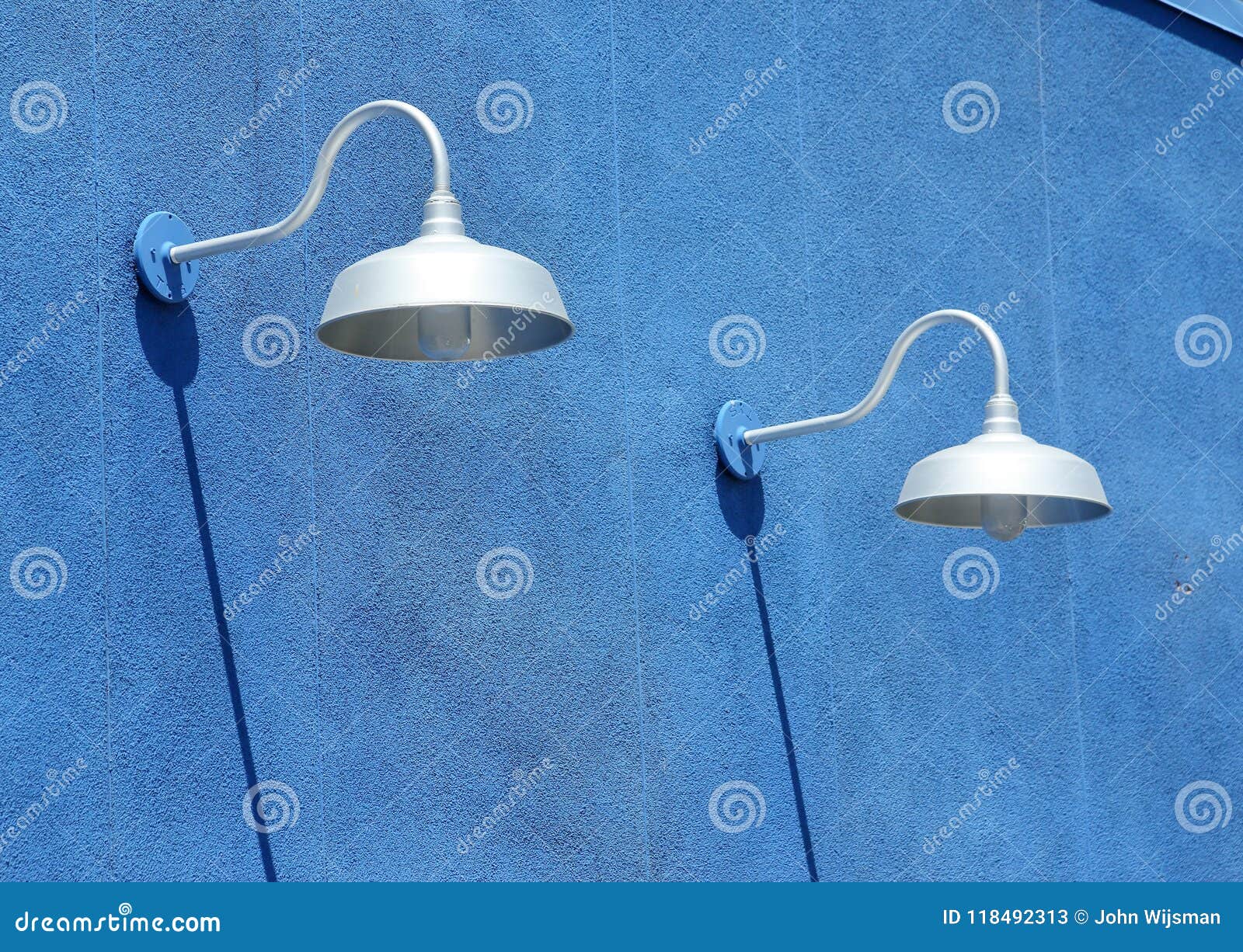 Blue Stucco Wall with Light Fixtures and Shadows Stock Image - Image of ...
