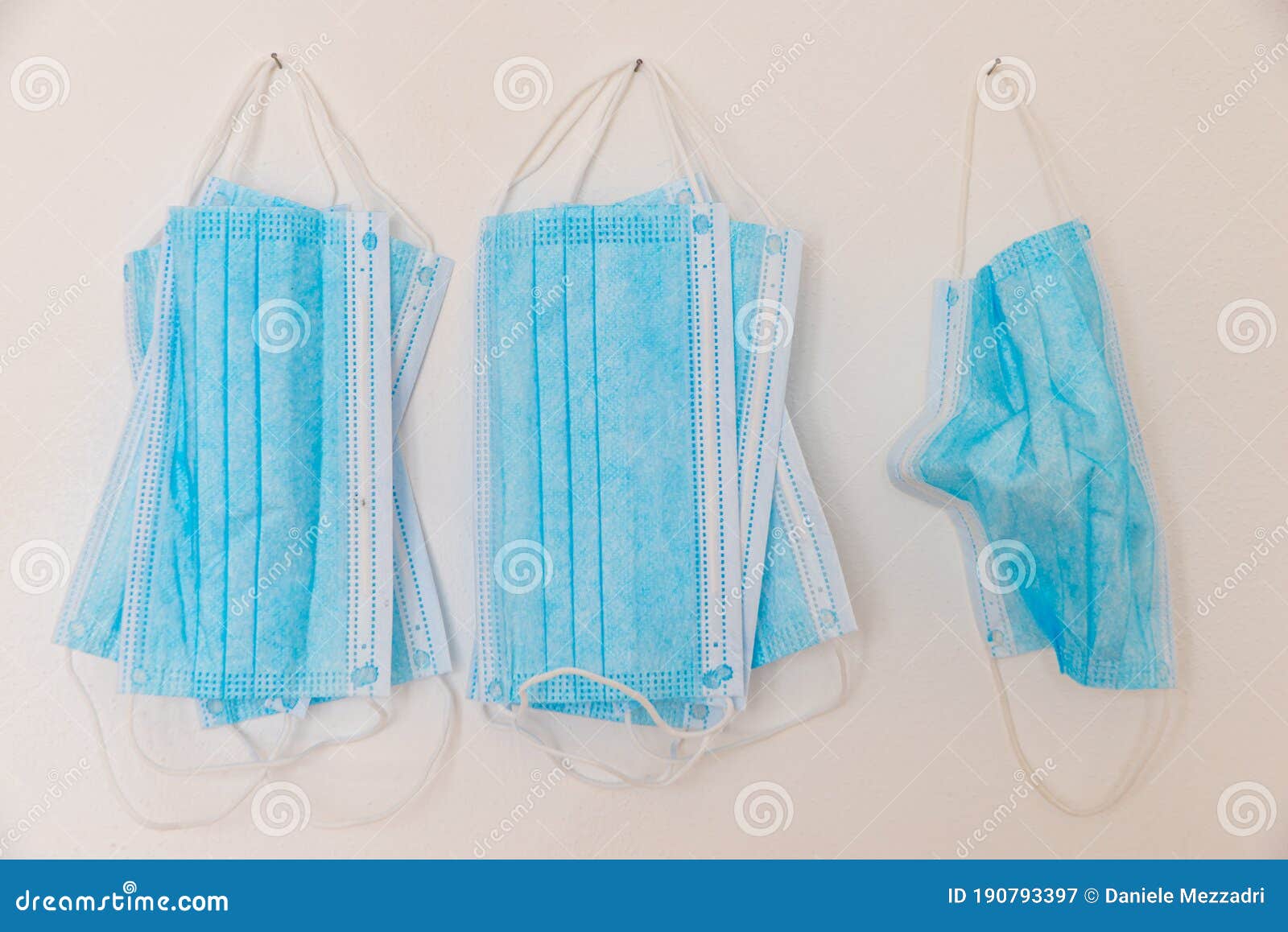 Surgical Masks Hanging on the Wall Stock Image - Image of physician ...