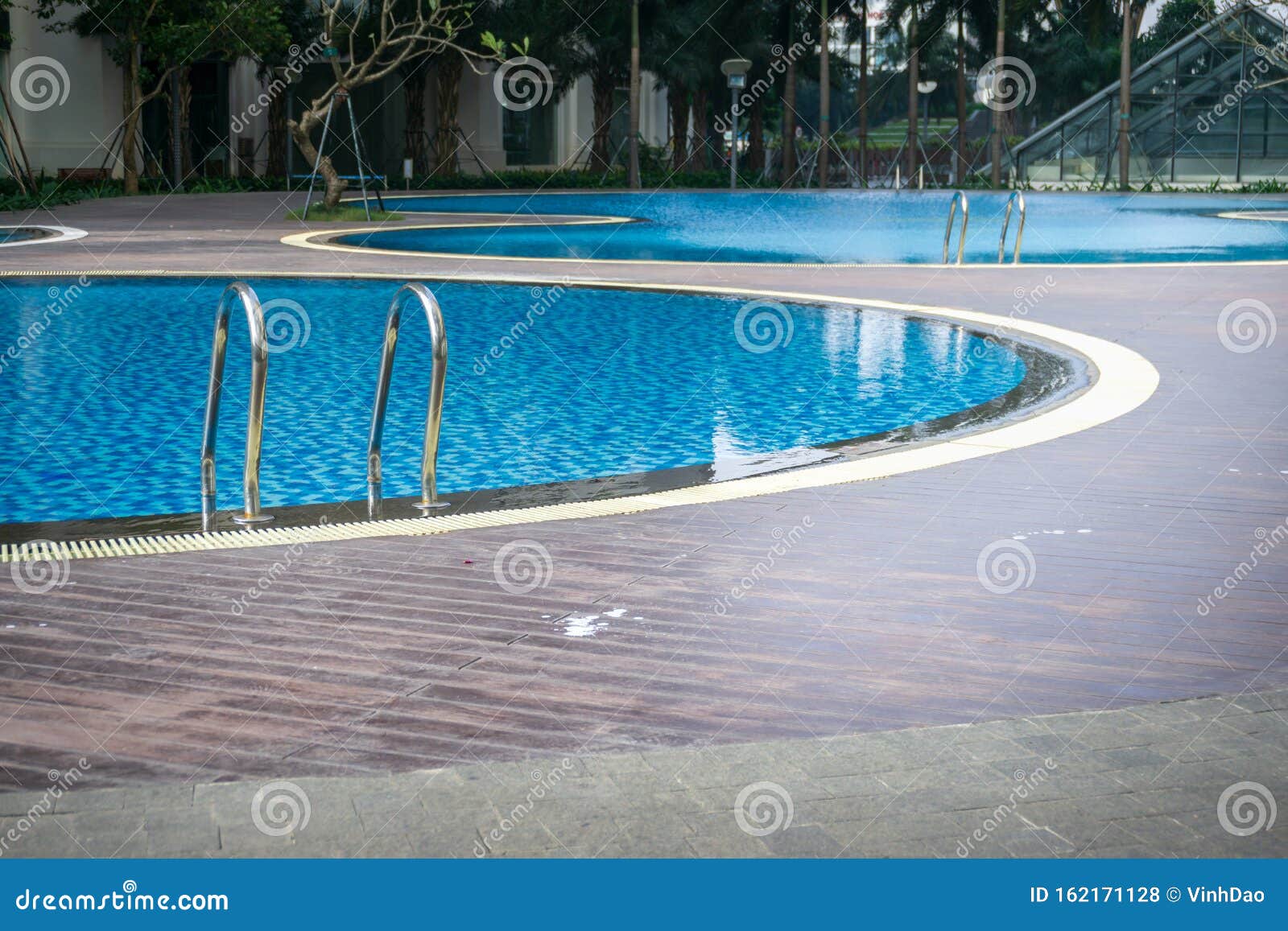 Blue Swimming Pool with Wood Flooring Stripes Stock Photo - Image of ...
