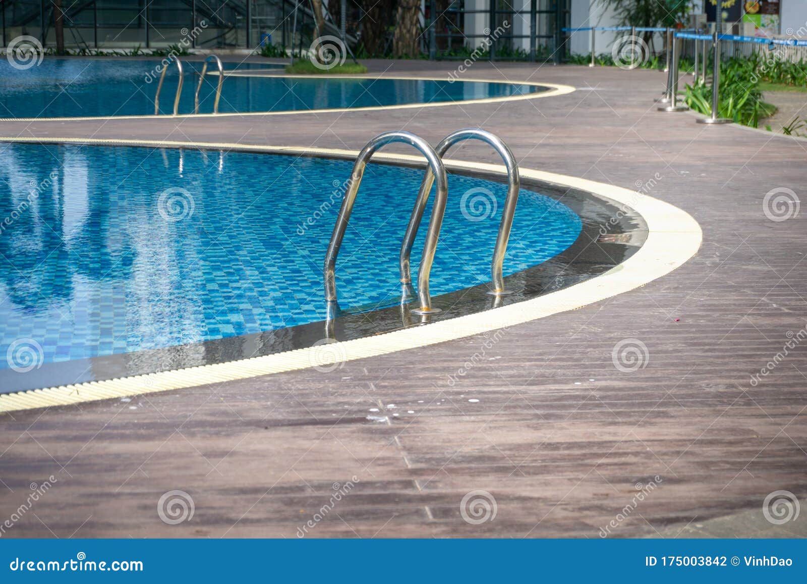 Blue Swimming Pool with Wood Flooring Stripes Stock Photo - Image of ...