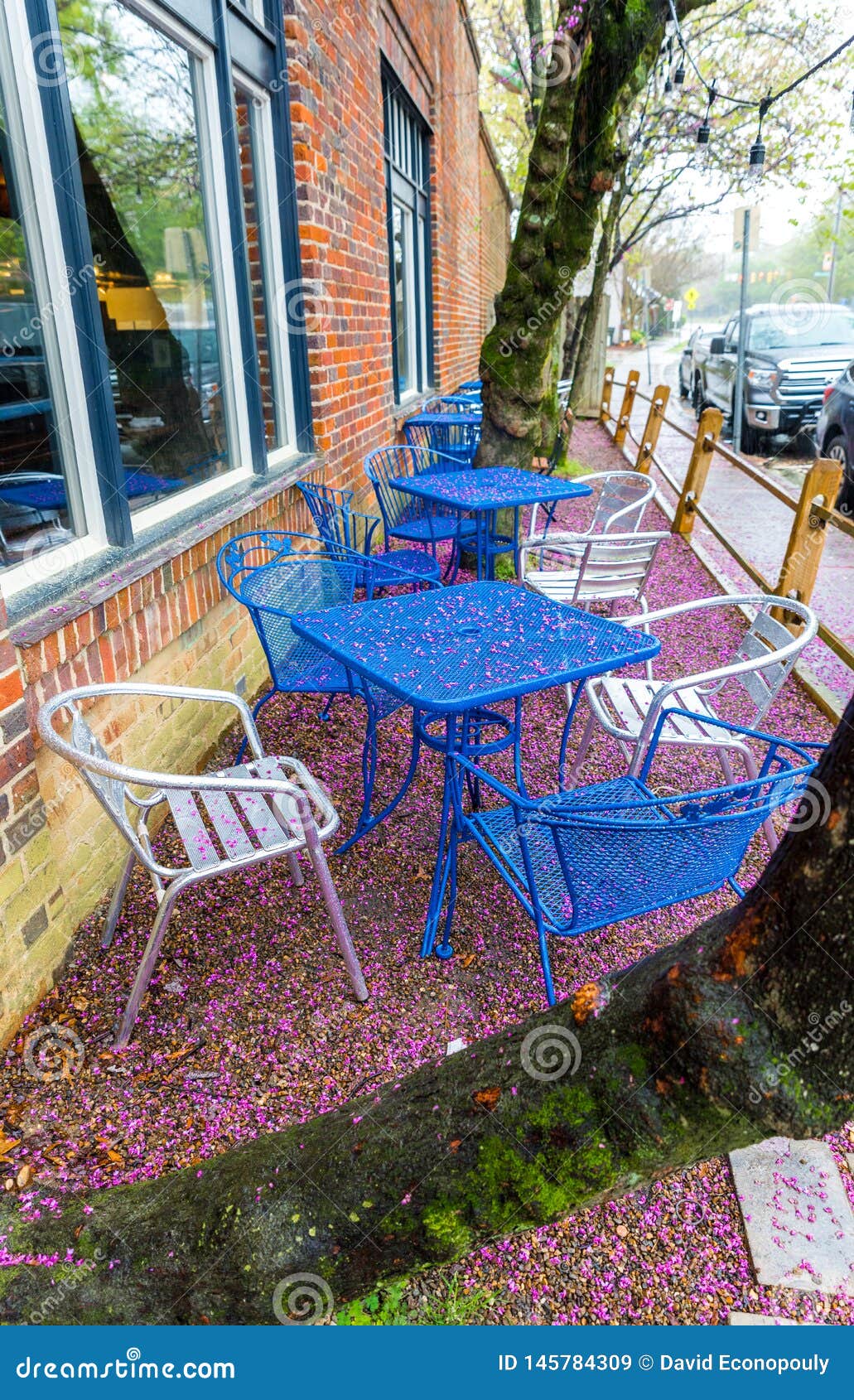Blue Table and Chairs at a Restaurant with Beautiful Flowering Trees ...