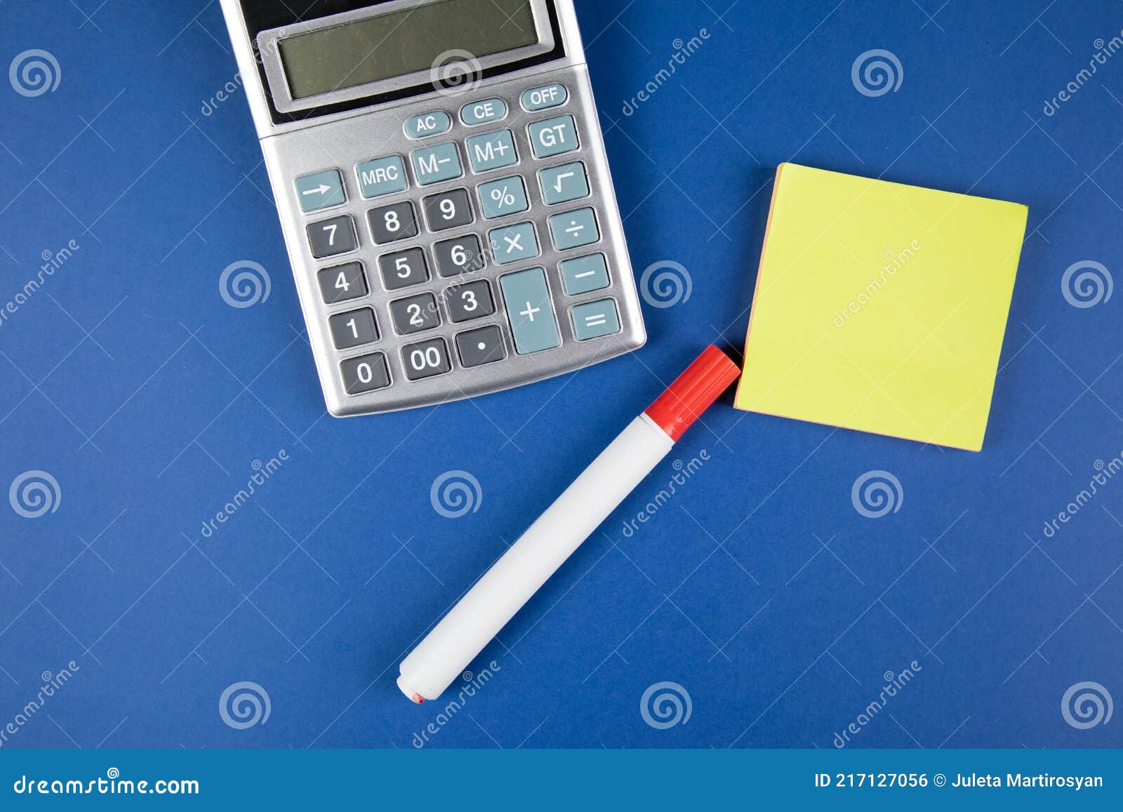 On the Blue Table Marker, Sticker and Calculator Stock Photo - Image of ...