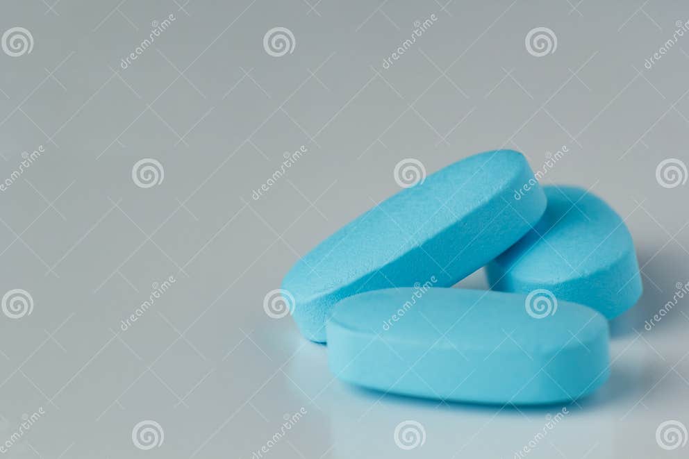 Blue Tablets on a Light Background, Vitamins and Medicines Stock Image ...