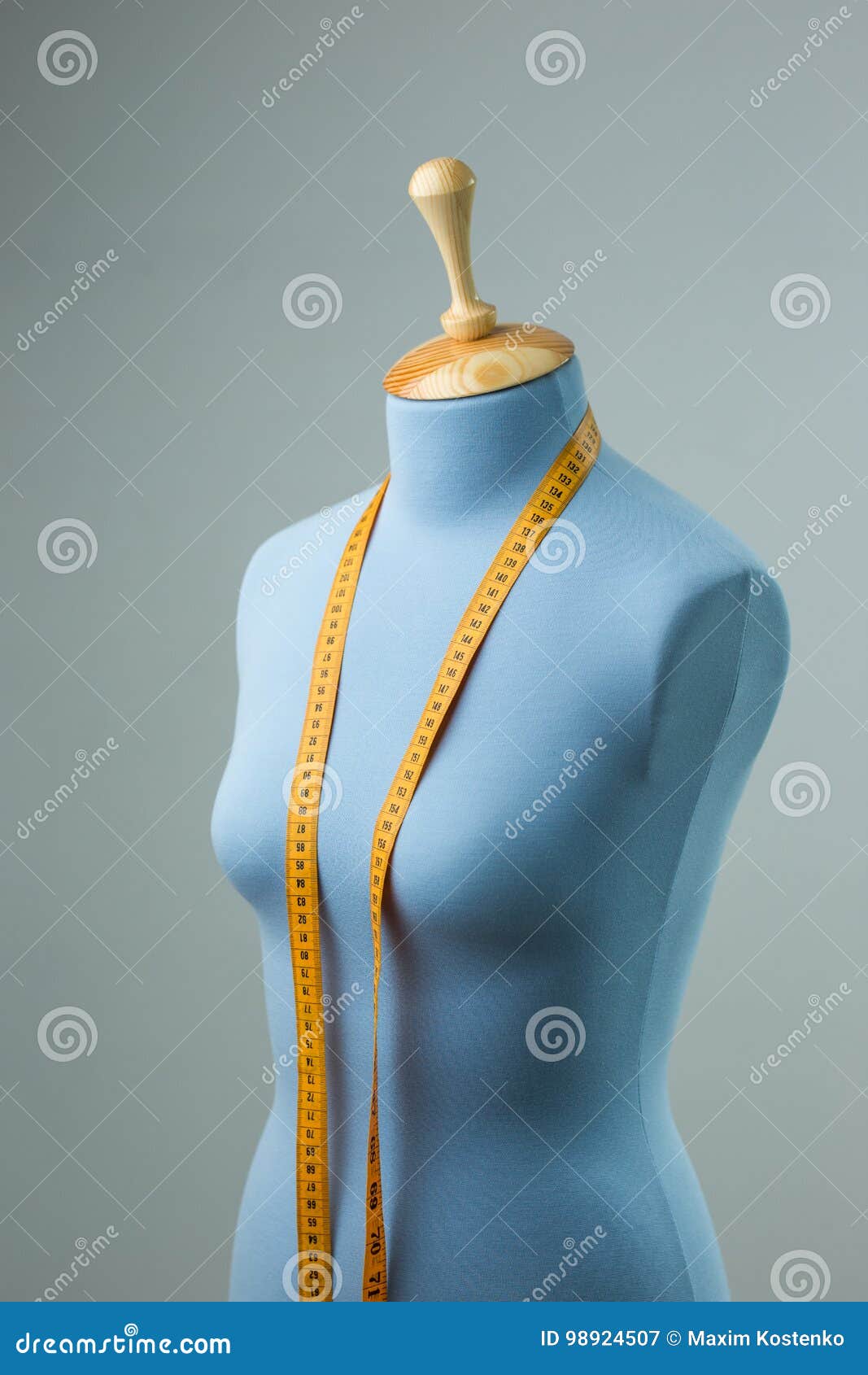 Blue Tailor Dummy with Measuring Tape Alongside the Wall. Stock Image ...