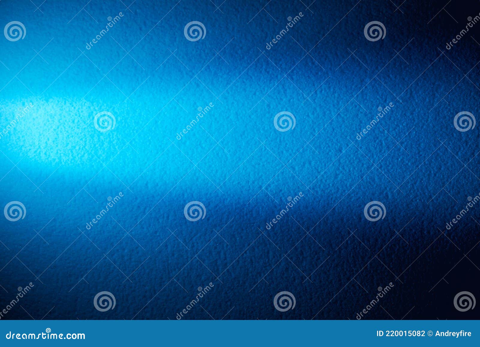 On the Blue Textural Background a Narrow Light Turquoise Ray of Light ...
