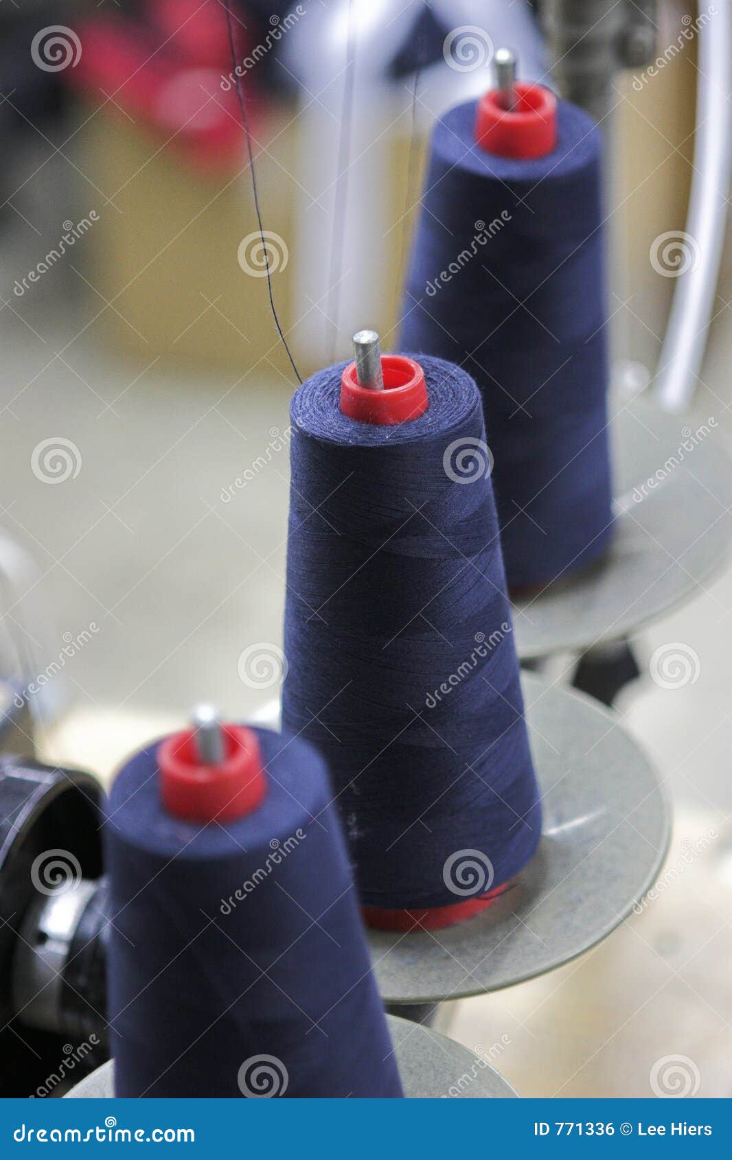 Blue thread on red bobbins stock photo. Image of nafta - 771336