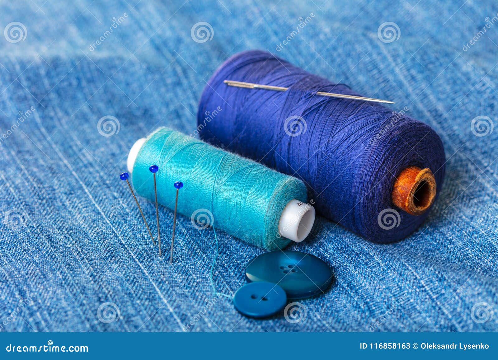 Blue threads with buttons stock image. Image of handmade - 116858163