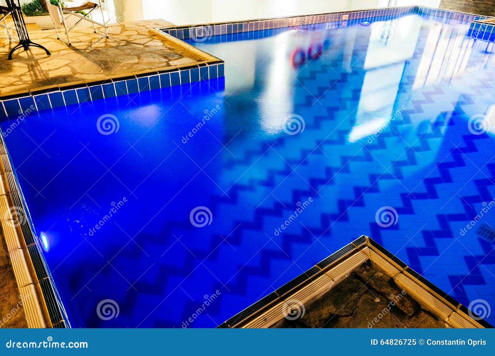 Blue tiled swimming pool stock image. Image of waters - 64826725