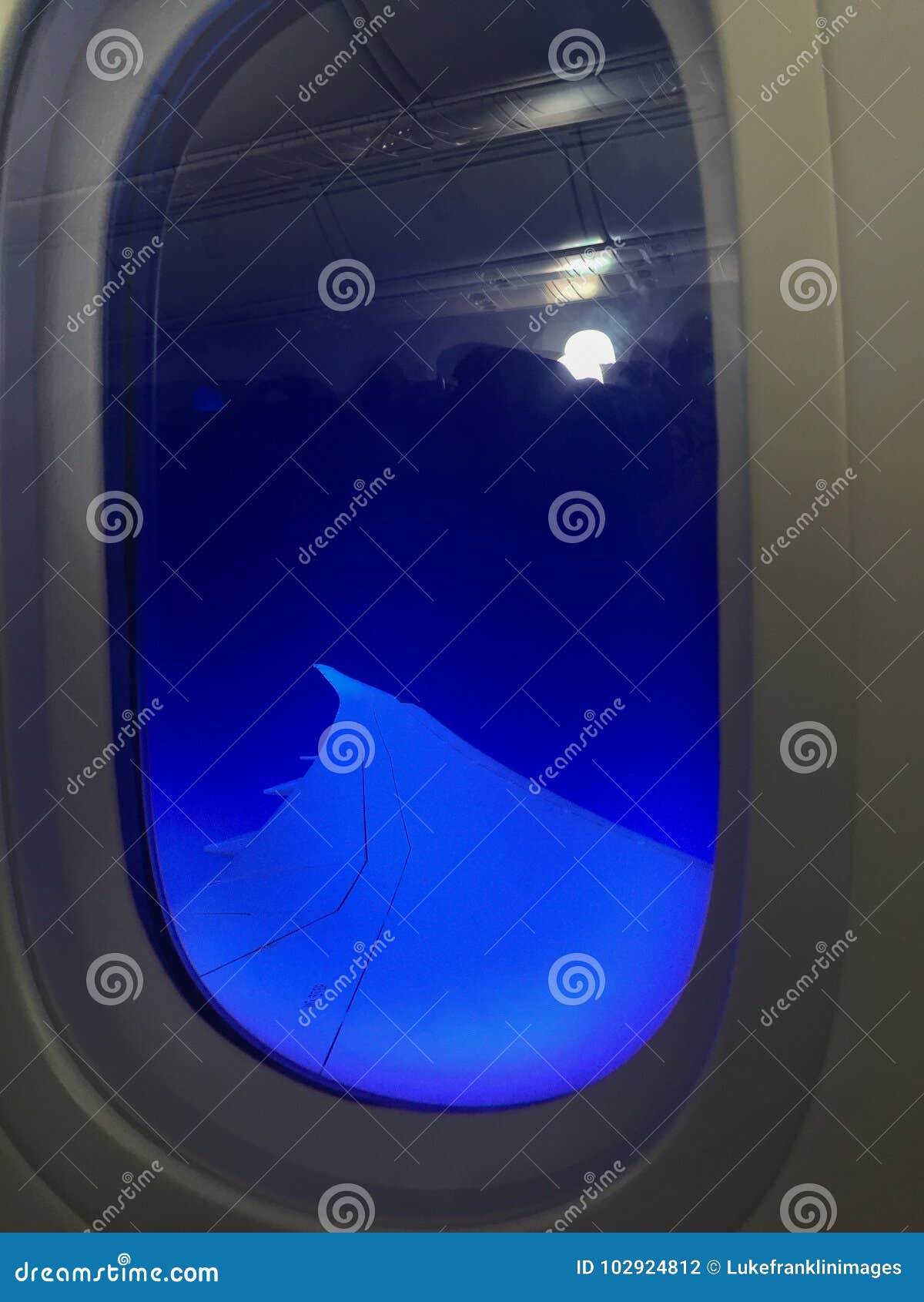 Blue Tinted Airplane Window Stock Photo - Image of aerial, scenery ...