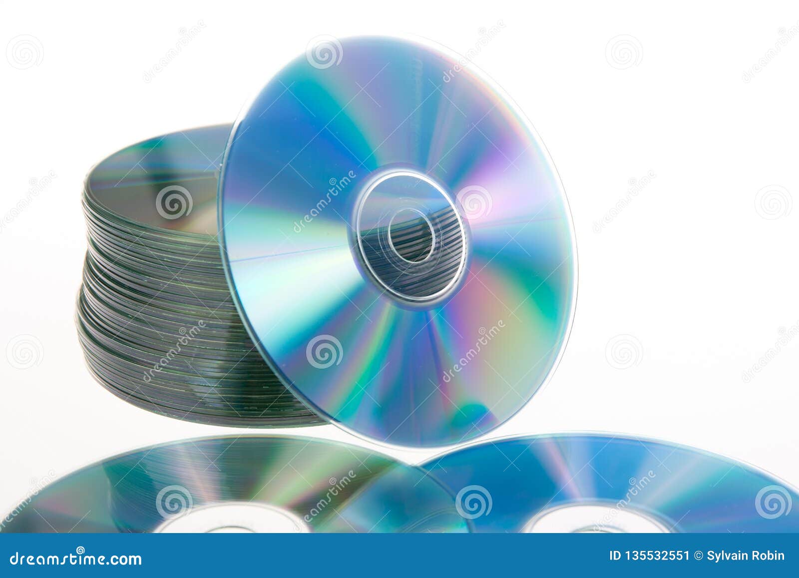 Blue Tinted Close-up of a Stack of Cd-roms CD Lying on White Table ...