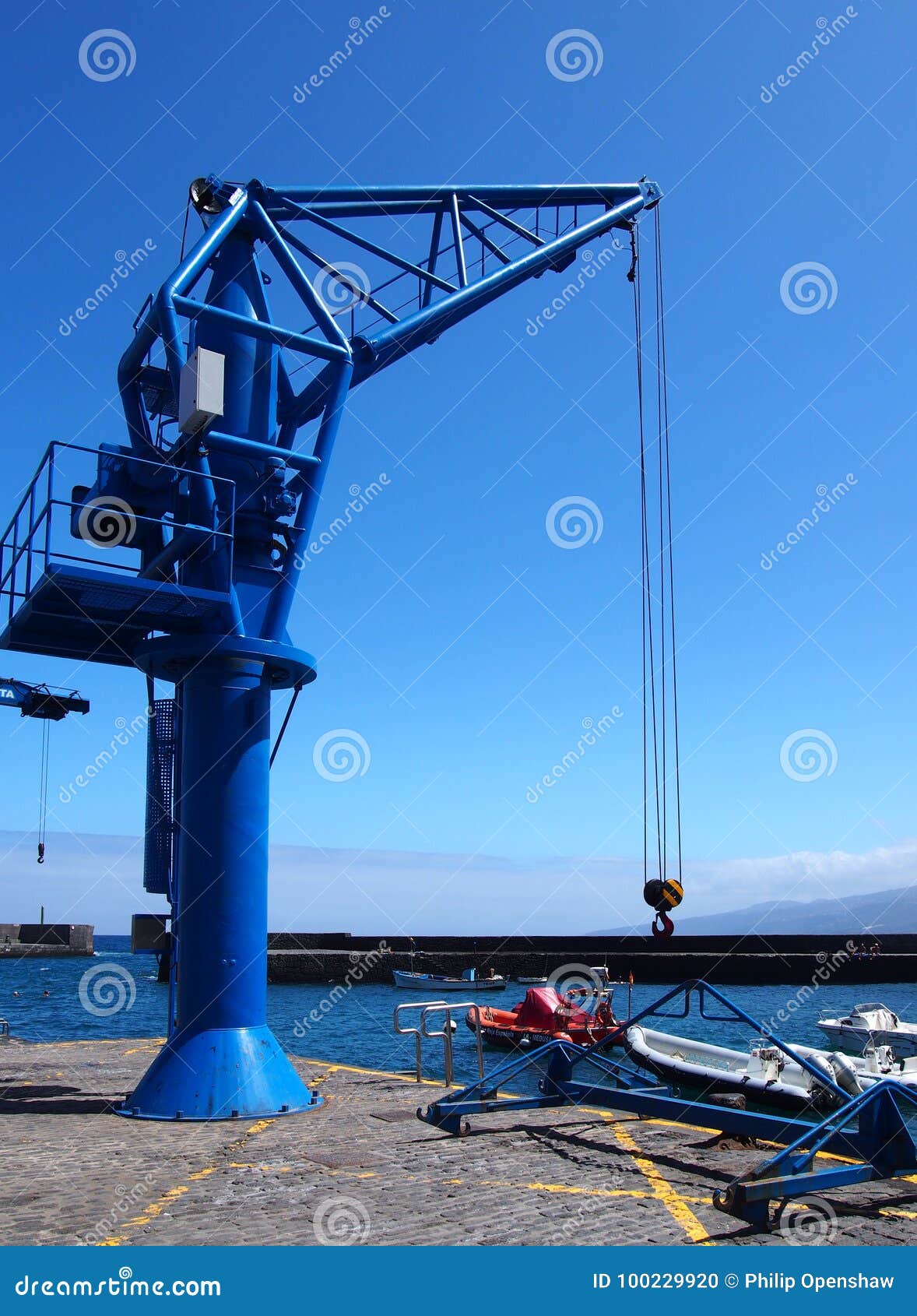 Blue Tower Crane in a Harbor Dockyard with Sea and Boat Editorial Image ...