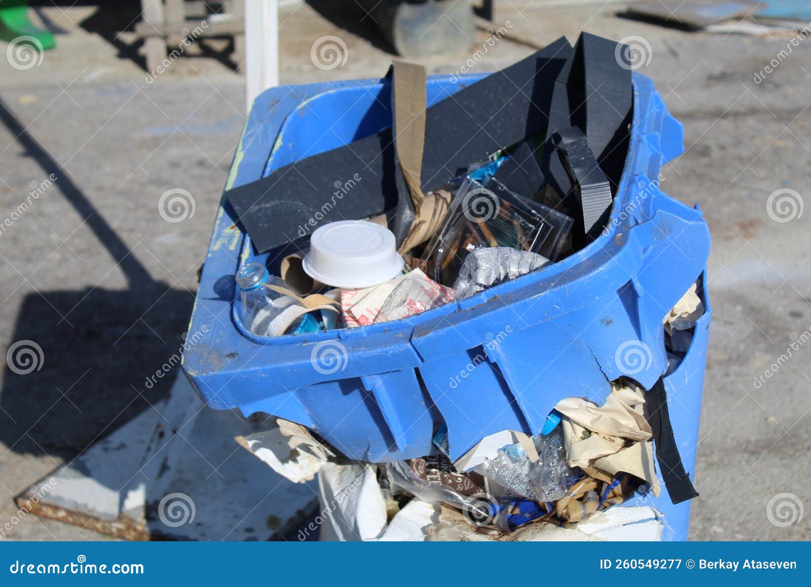 A Blue Trash Bin Full of Trash and Plastic for Recycle Stock Image ...