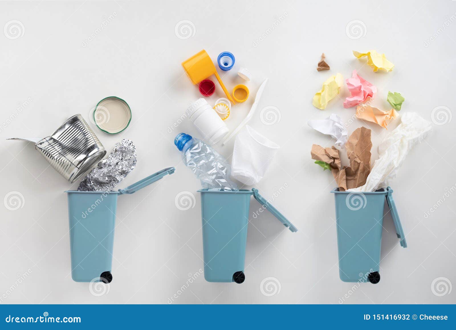 Trash Bins and Assorted Garbage on Grey Background. Recycle Concept ...