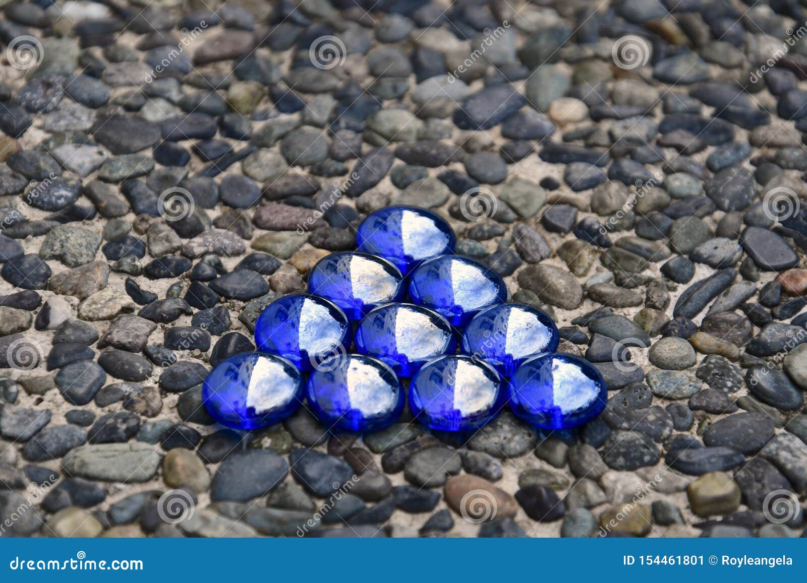 Blue Triangle on Pebblestone Background Stock Image - Image of ...