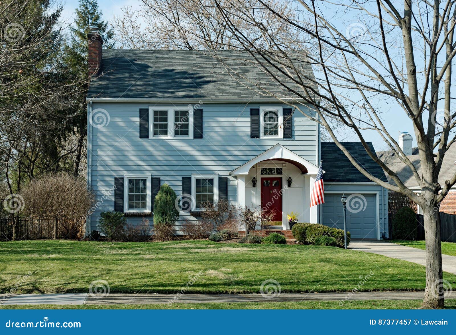 Blue Two Story House with American Flag Stock Image - Image of outside ...