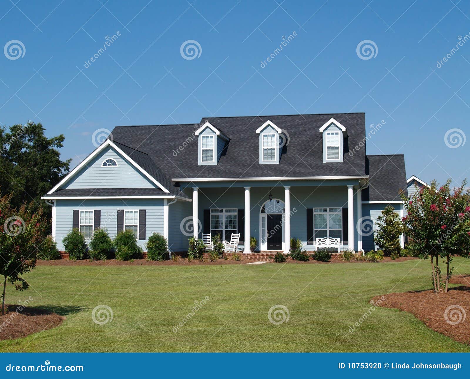 Blue Two Story Residential Home Stock Photo - Image of landscaping ...