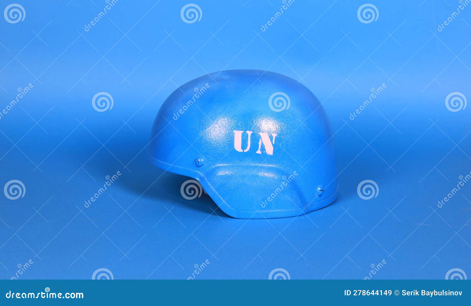 Blue UN Helmet Isolated on Blue Stock Image - Image of protect, armed ...