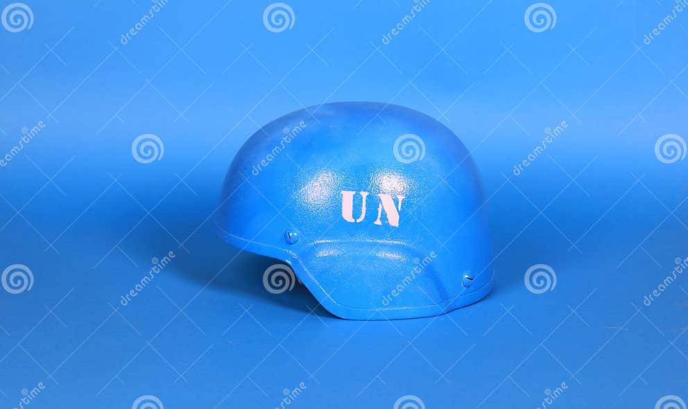 Blue UN Helmet Isolated on Blue Stock Image - Image of protect, armed ...