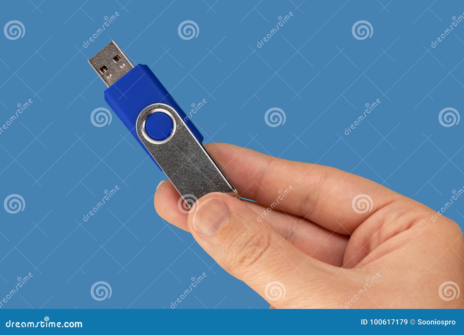 Blue USB Memory Stick on Hand with Blue Background Stock Image - Image ...