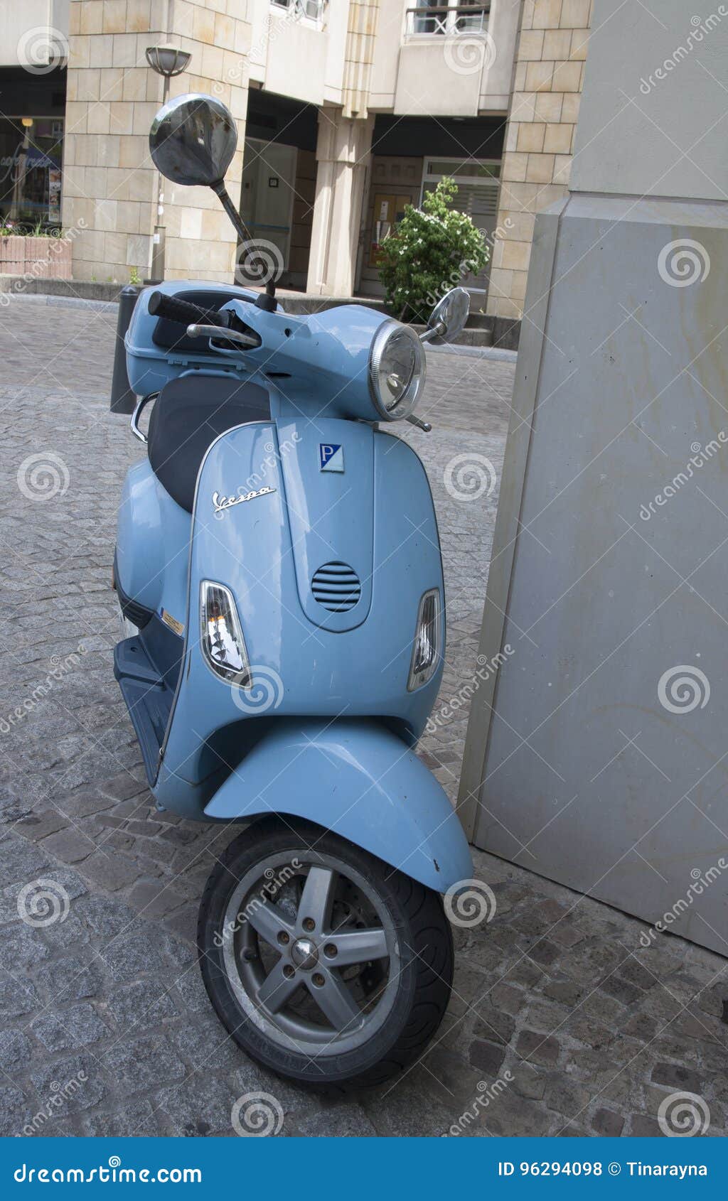 A blue Vespa motorcycle editorial stock photo. Image of parked - 96294098