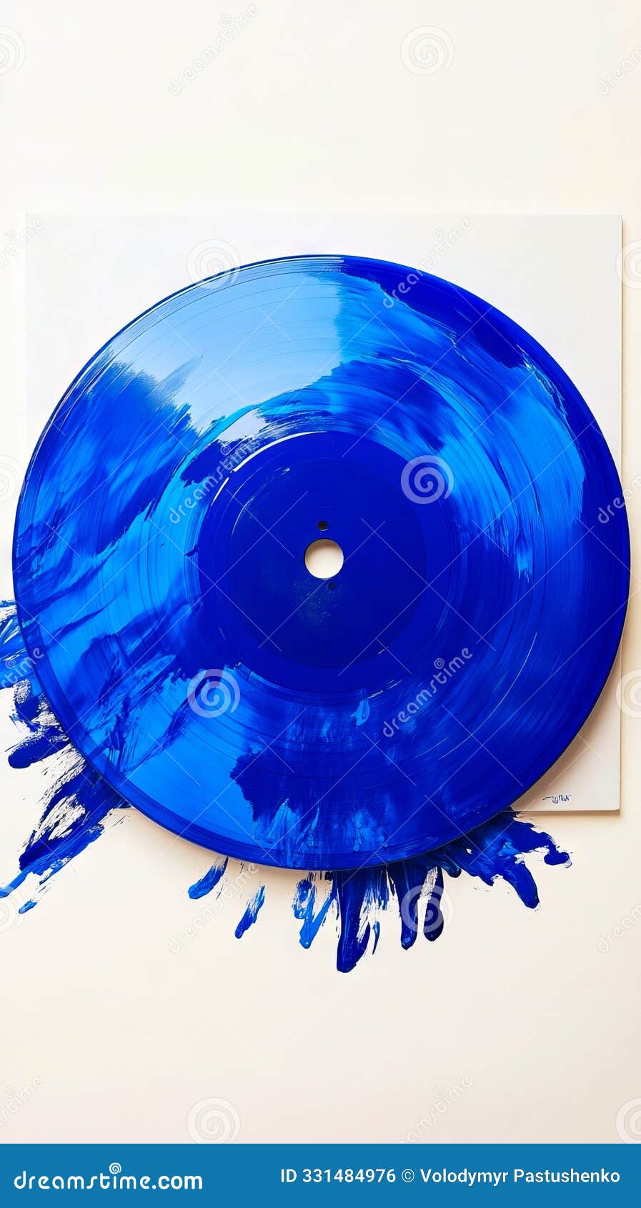 A Blue Vinyl Record with Blue Paint Splattered on it Stock Photo ...