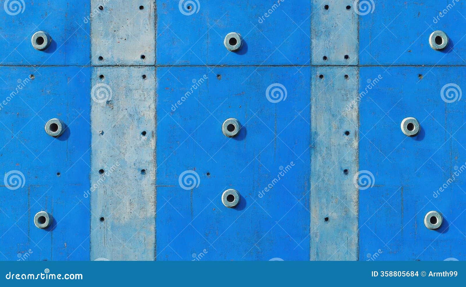 Blue Wall Panels with Circular Inserts and Concrete Dividers ...