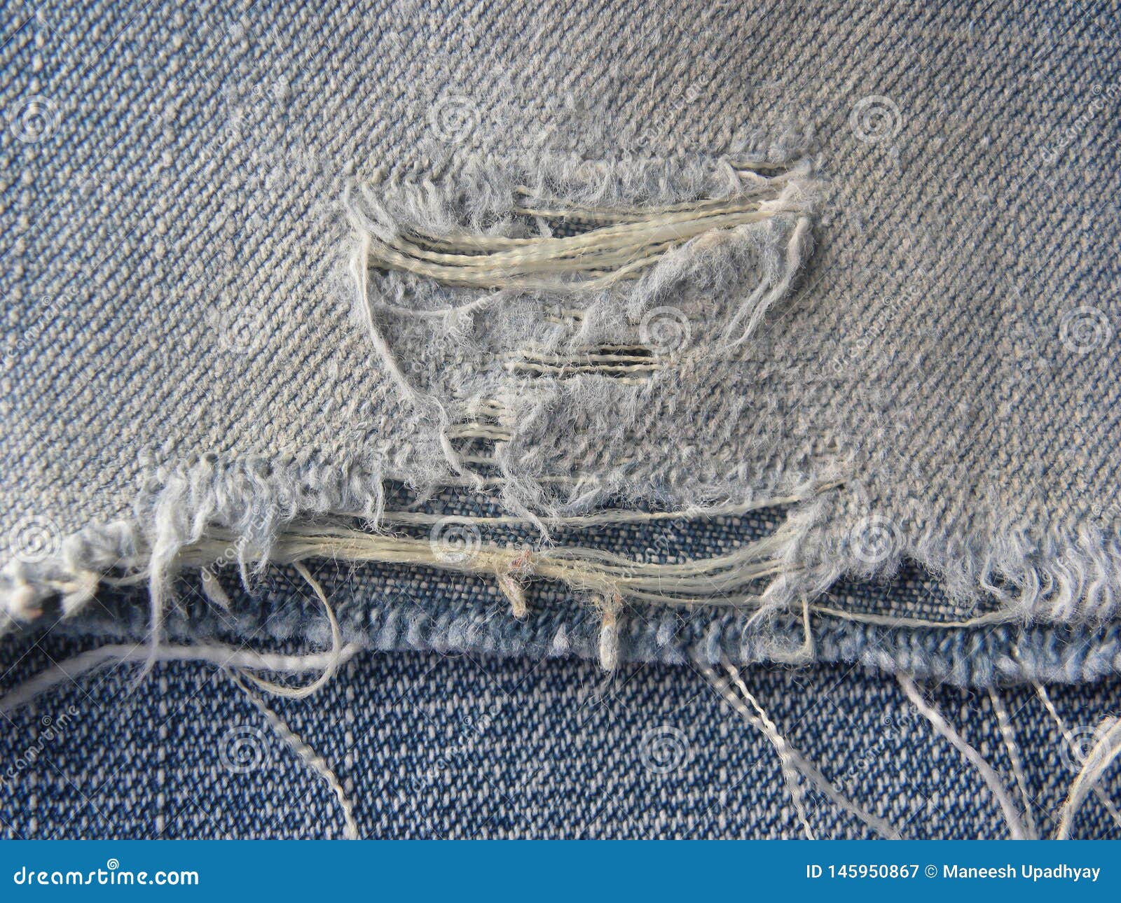 Blue Washed Ripped Jeans with Threads Background Stock Image - Image of ...